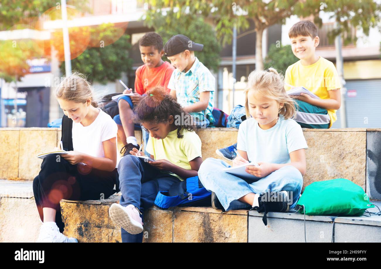 Group of kids having open air lesson Stock Photo - Alamy