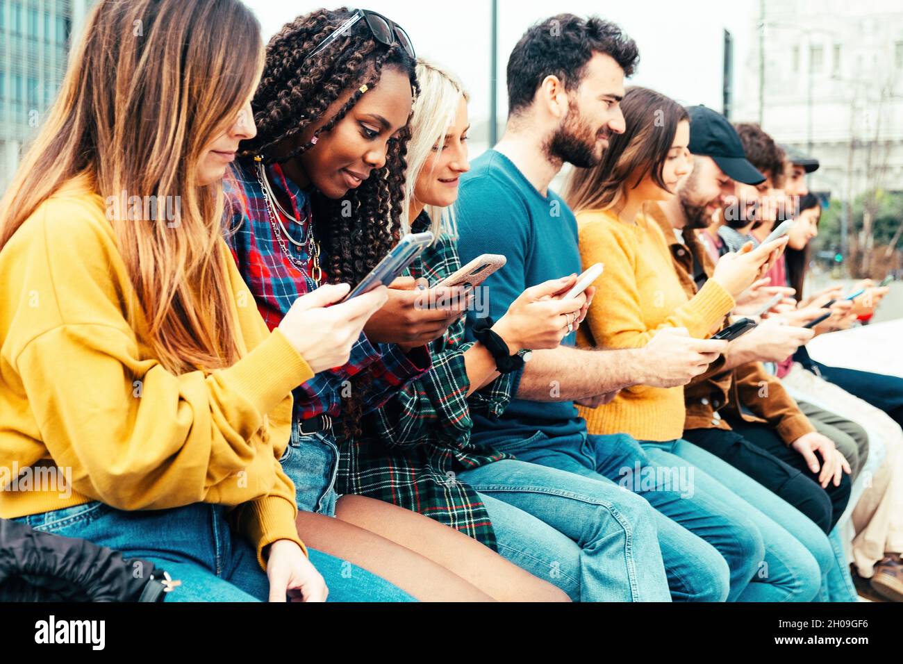 Group of people sitting with phone hi-res stock photography and images ...