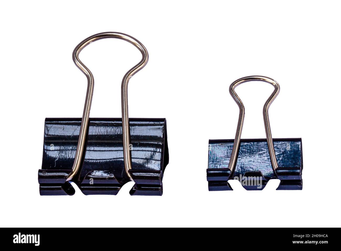 Two black metal paper clips, isolated with a white background, for ...