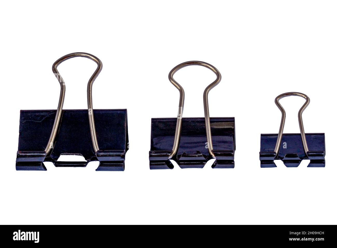 Three black metal paper clips, isolated with a white background, for ...