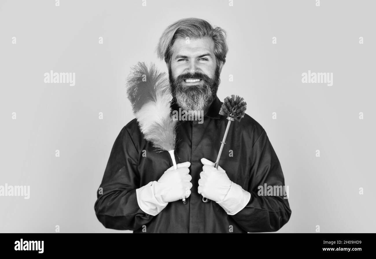Man holding cleaning supplies Black and White Stock Photos & Images - Alamy