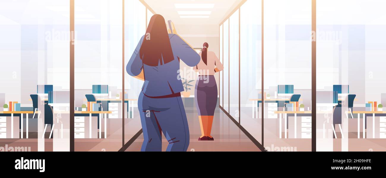 businesswomen couple standing back to camera rear view of business ...