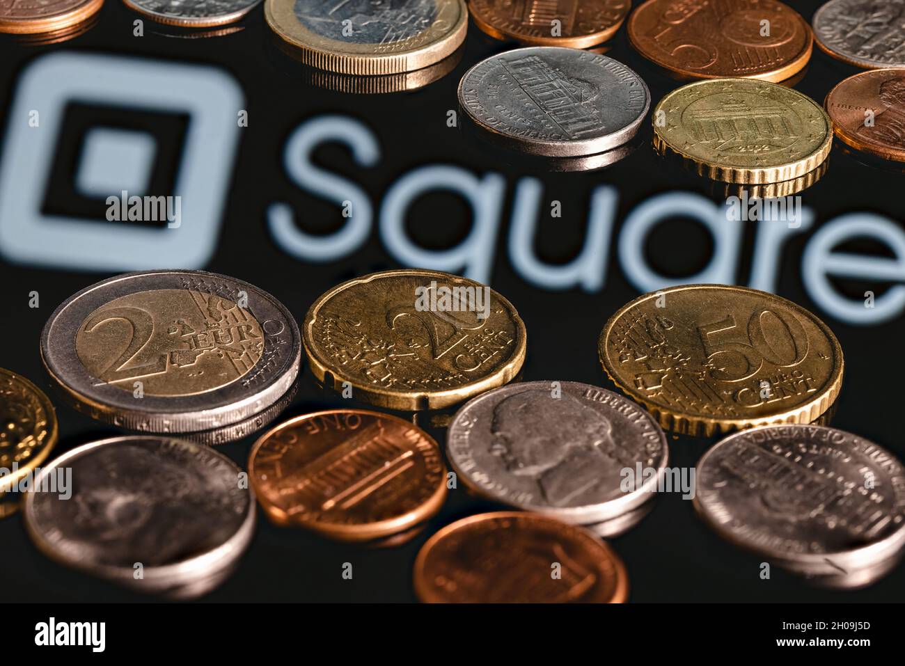 Metal coins on the background of the Square logo Stock Photo - Alamy