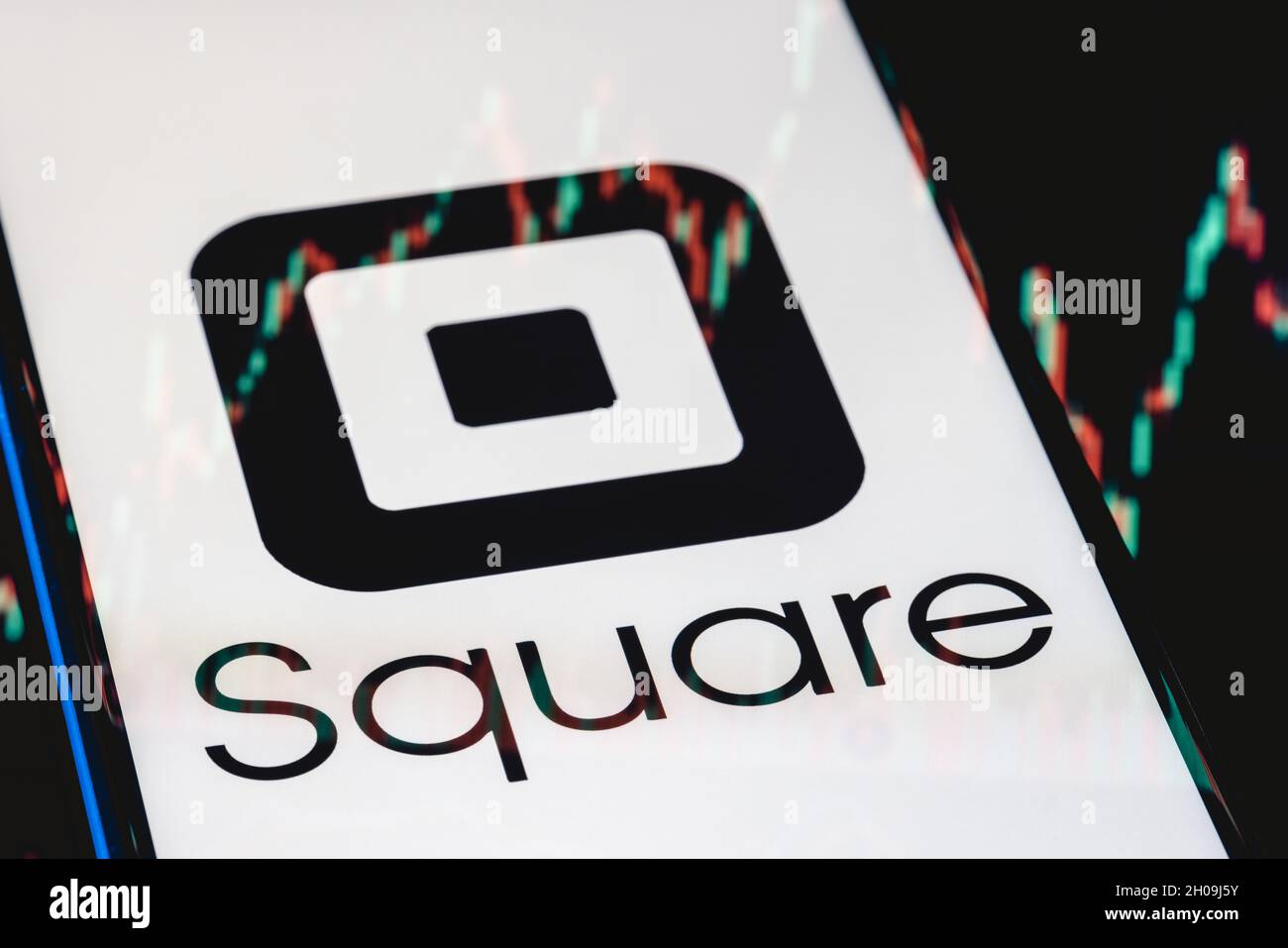 Square logo on smartphone screen. Stock chart in the reflection Stock ...