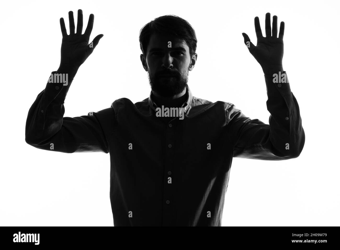 businessmen with a pistol in hand crime hand gesture light background ...