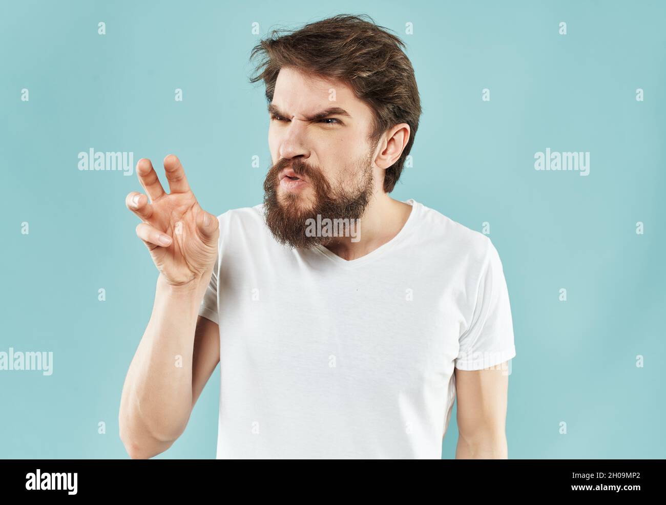 bearded man in a white t-shirt hand gestures anger Lifestyle Stock ...
