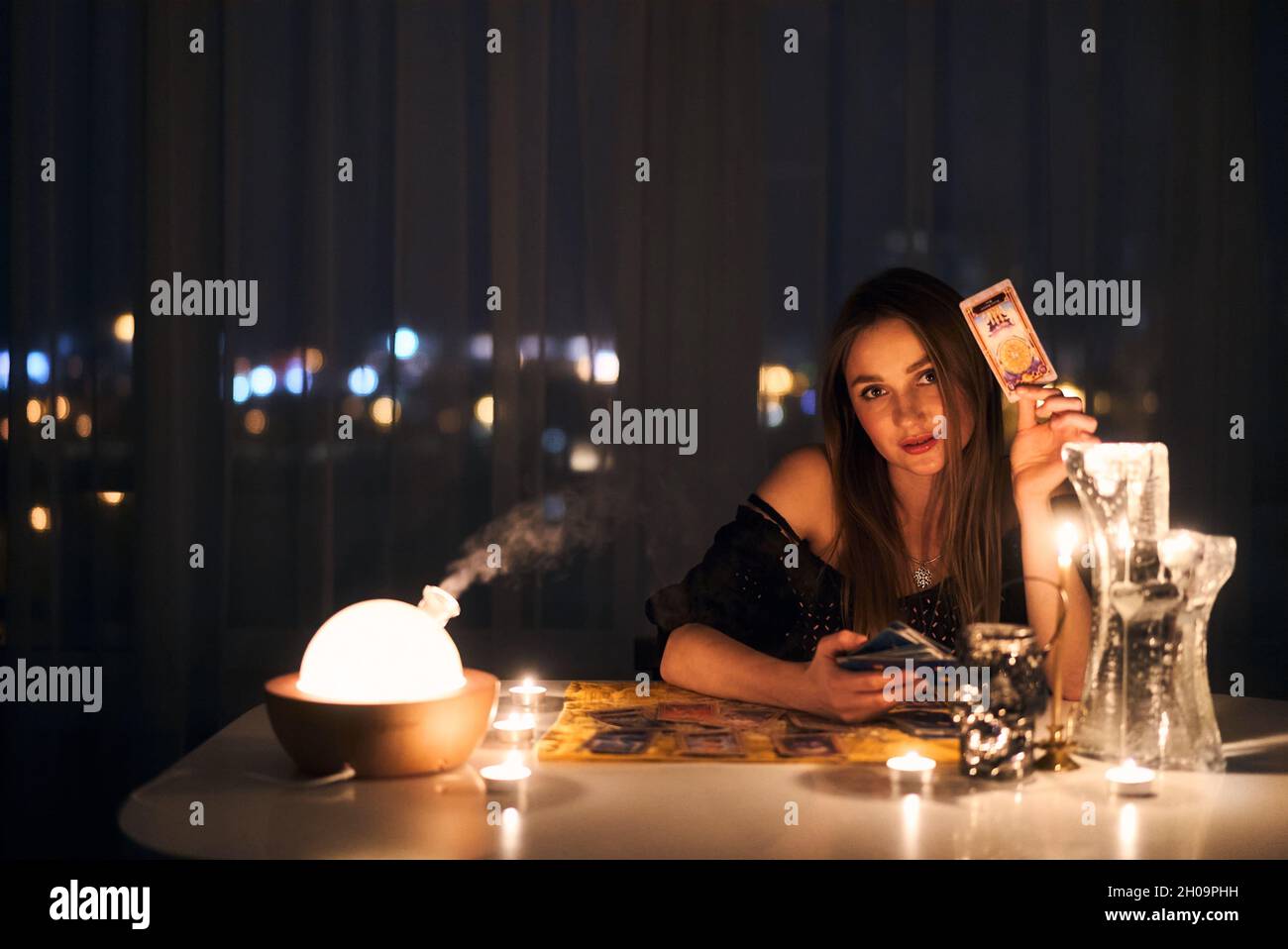 Gypsy fortune teller shuffling occult tarot cards. Magical pagan ...