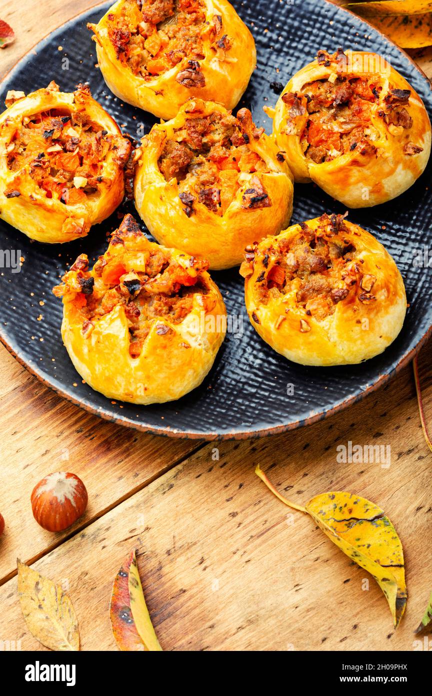 Autumn homemade patty.Tasty buns with minced meat and pumpkin Stock ...