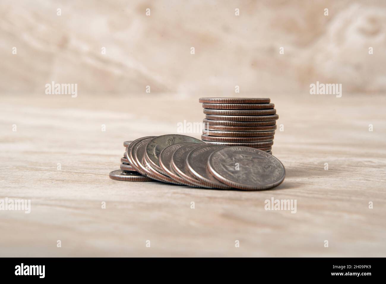 A stack of quarters on a countertop. USD, US currency Stock Photo - Alamy