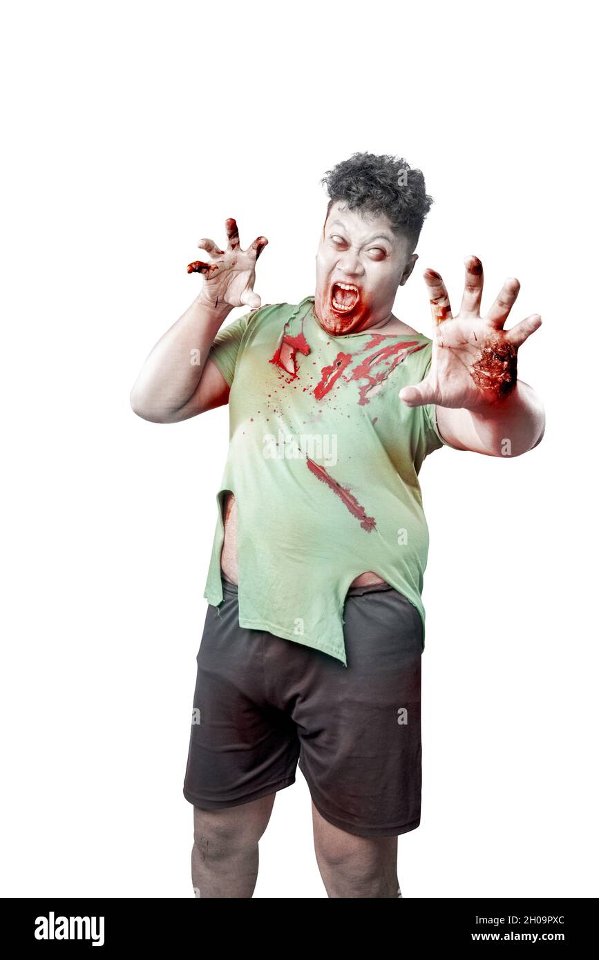 Scary zombie with blood and wound on his body standing isolated over ...