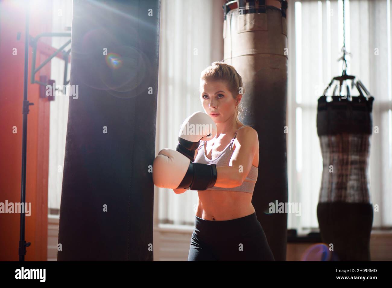 A female boxer train hard in a boxing studio Stock Photo - Alamy