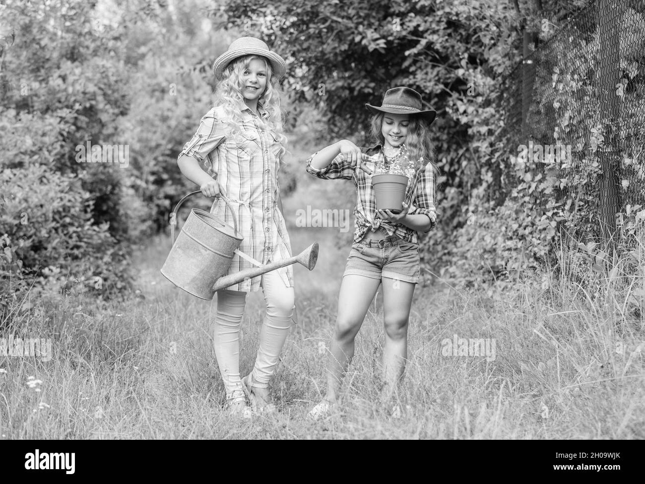 Rustic children nature background. Agriculture concept. Girls in hats ...