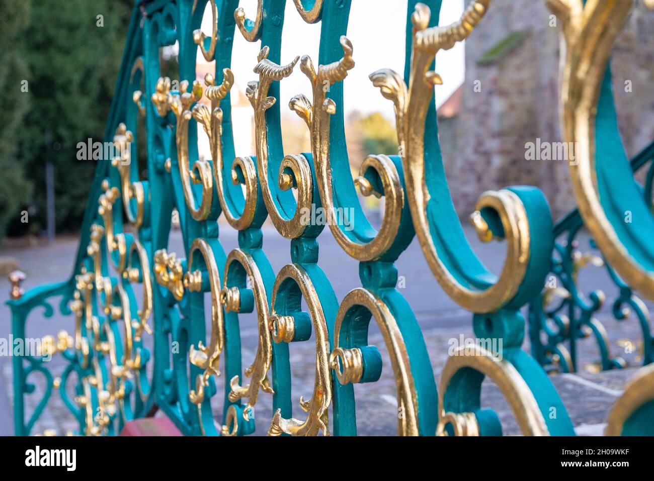 Closeup shot of blue and gold colored wrought iron made railing with ...