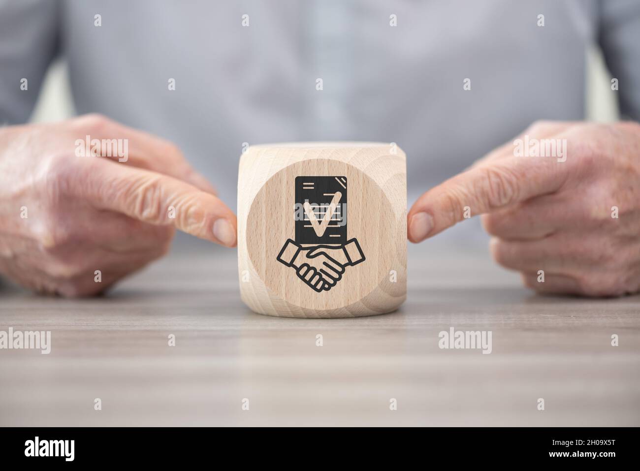 Wooden block with symbol of deal concept Stock Photo - Alamy