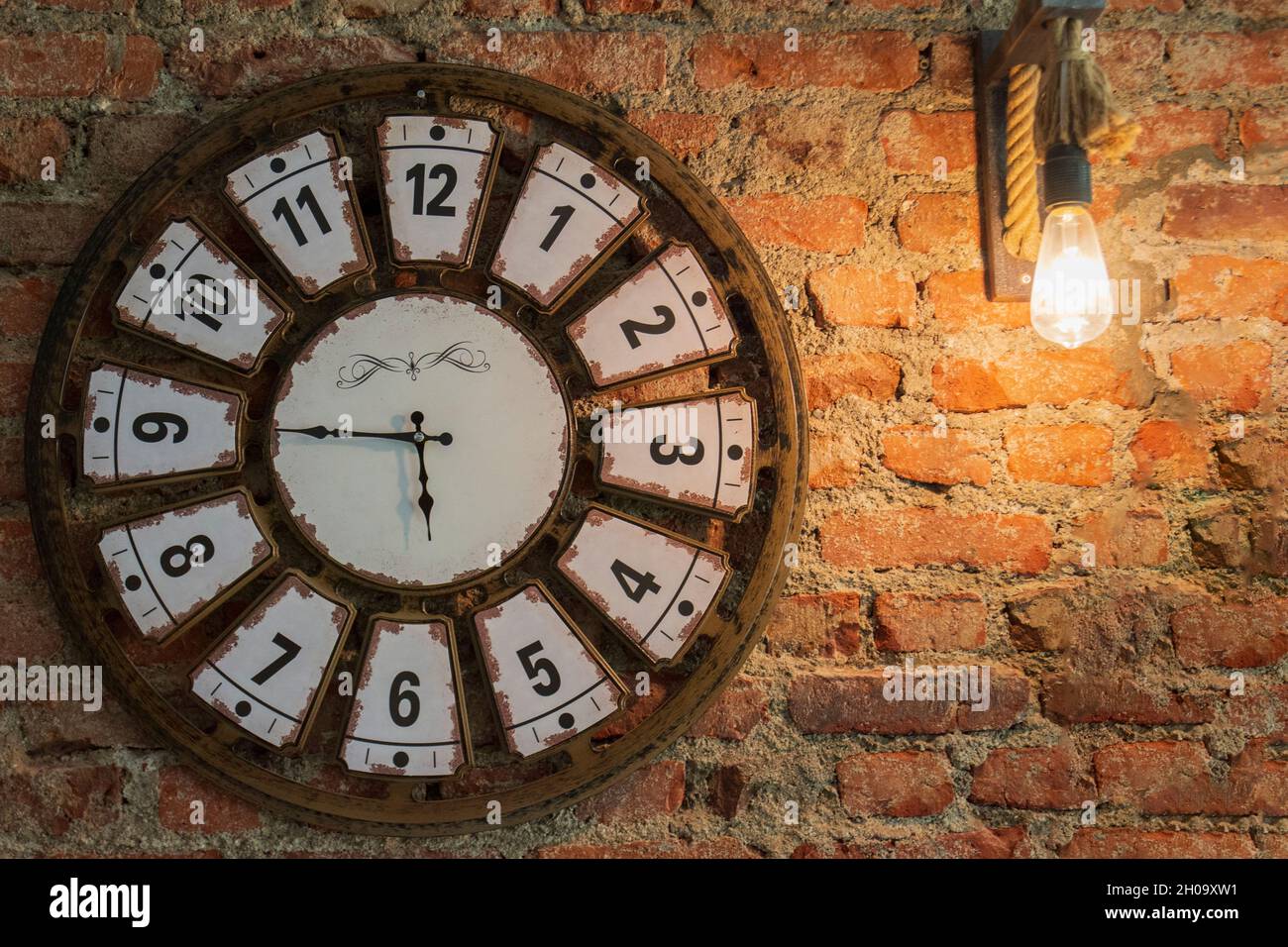 Clock hanging on building hi-res stock photography and images - Alamy