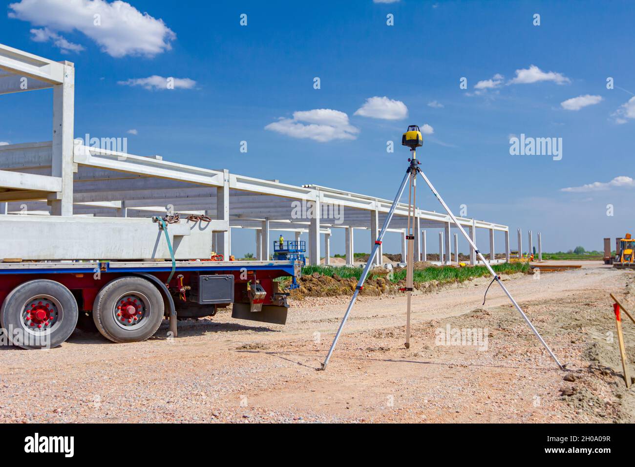 Total center device on tripod with laser for leveling other devices to ...