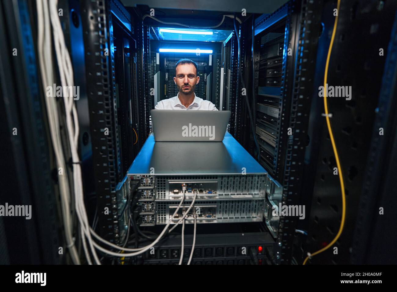 Data center server administrator checking equipment functionalities ...