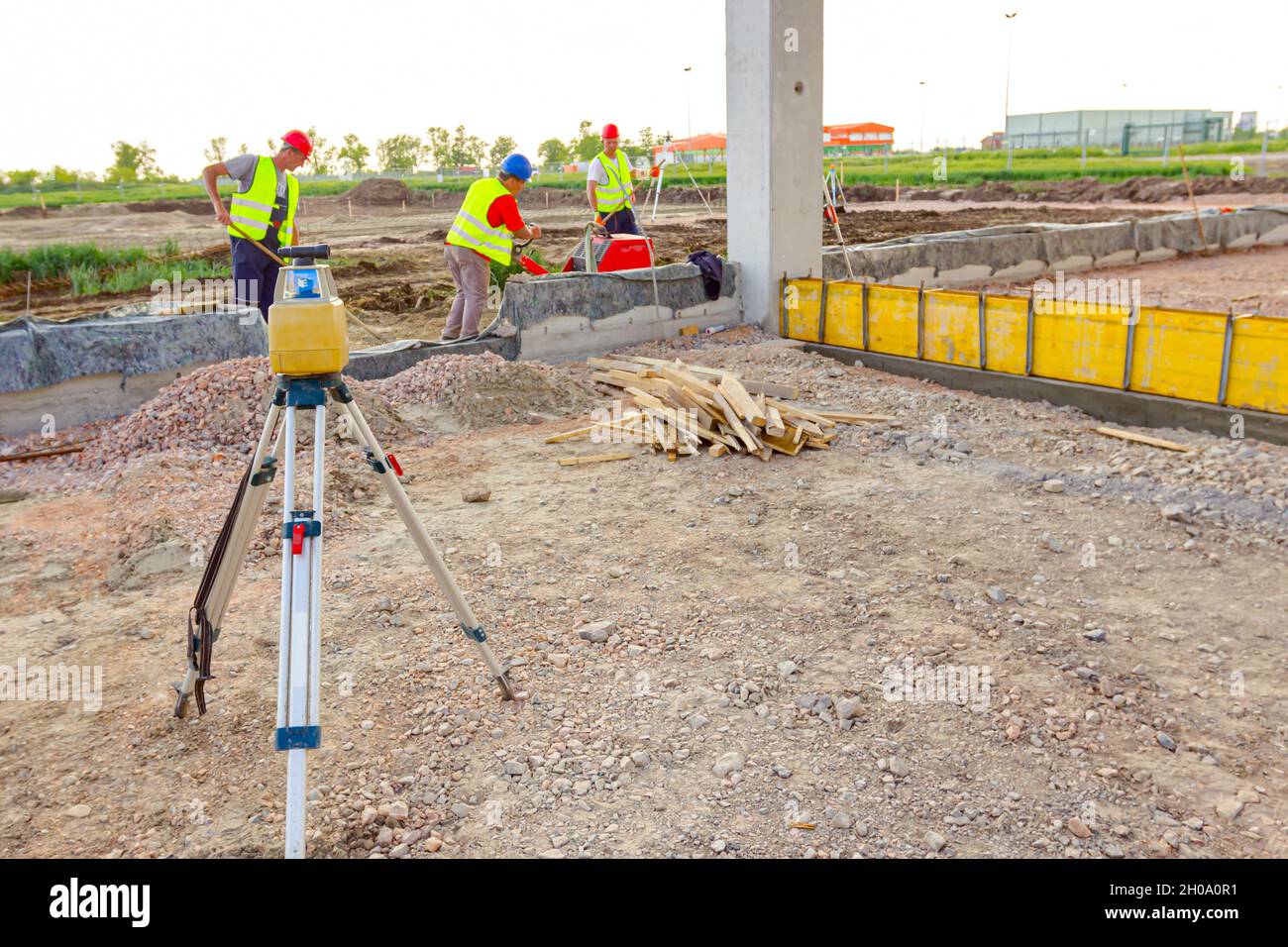 Total center device on tripod with laser for leveling other devices to ...