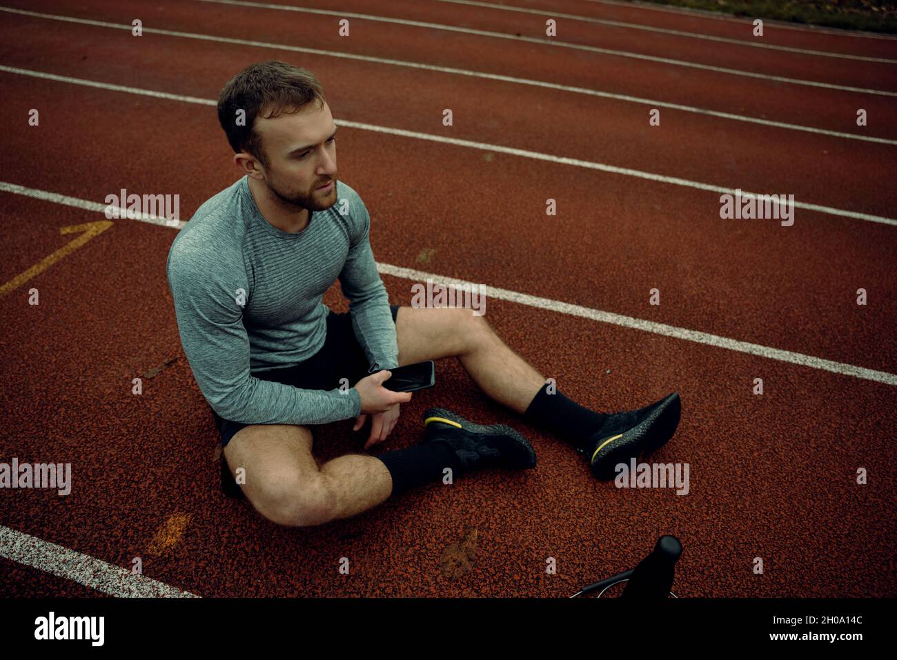 Young athlete runner sitting muscle hi-res stock photography and images ...