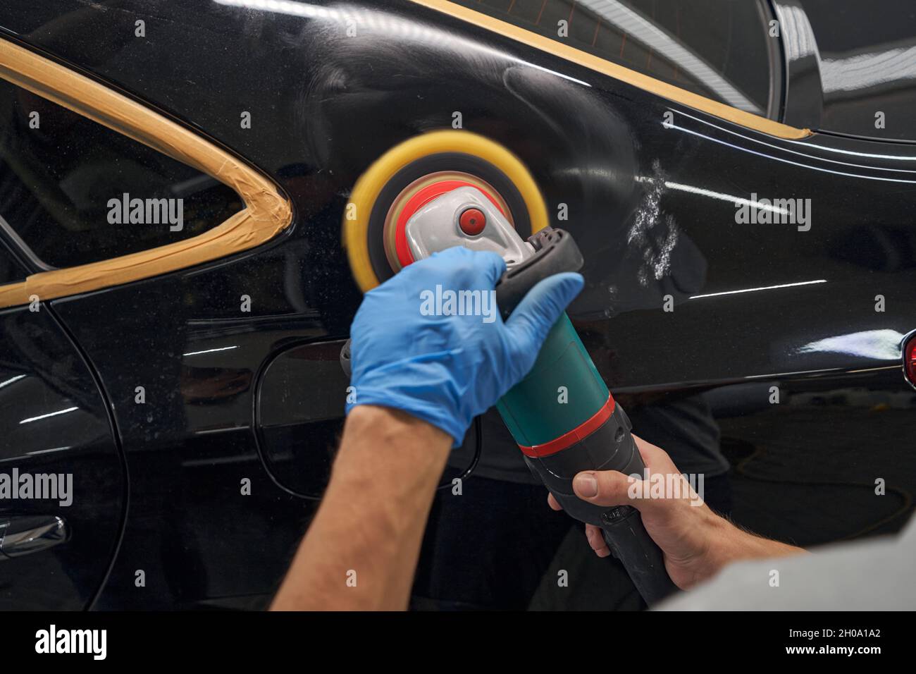 View of person hands polishing car with orbital polisher Stock Photo ...