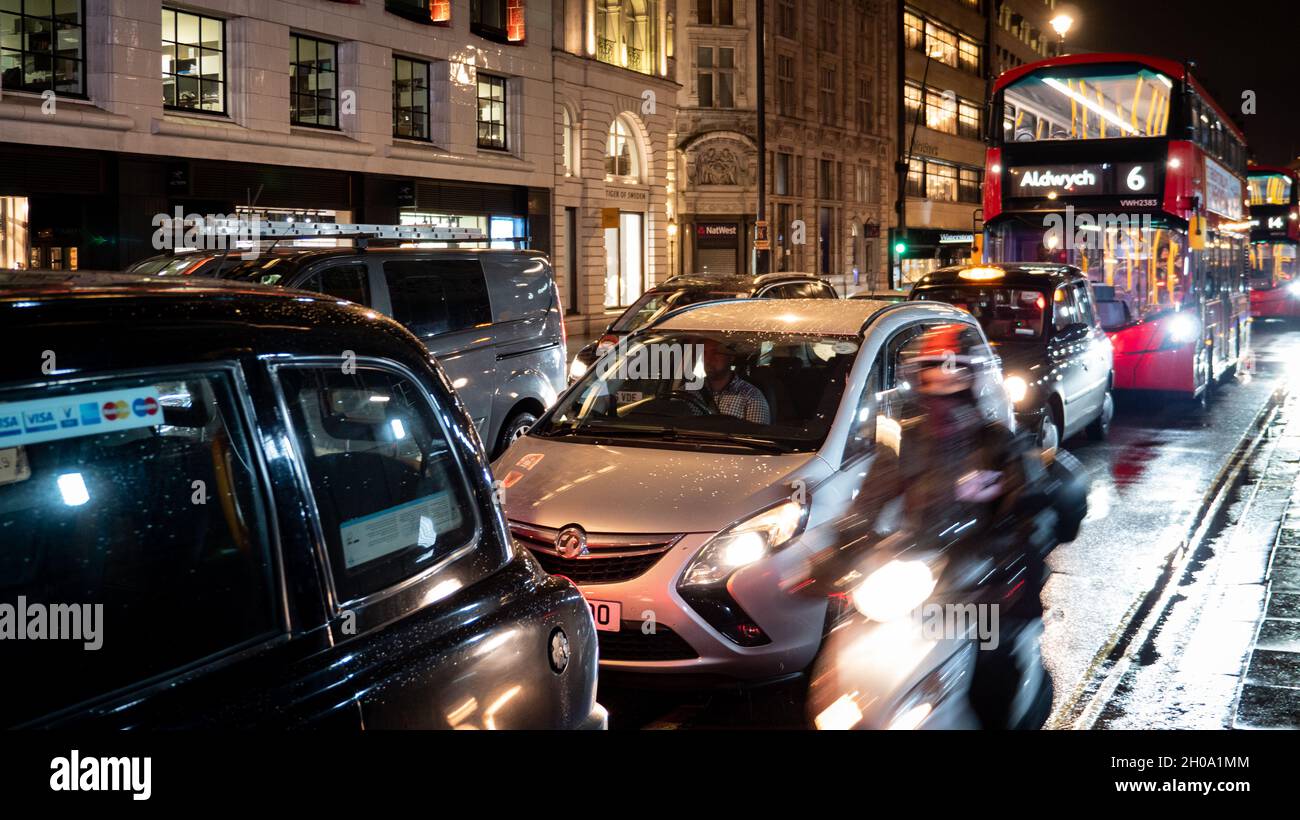 Late night traffic jam on the wet streets of London's Strand. Motion ...