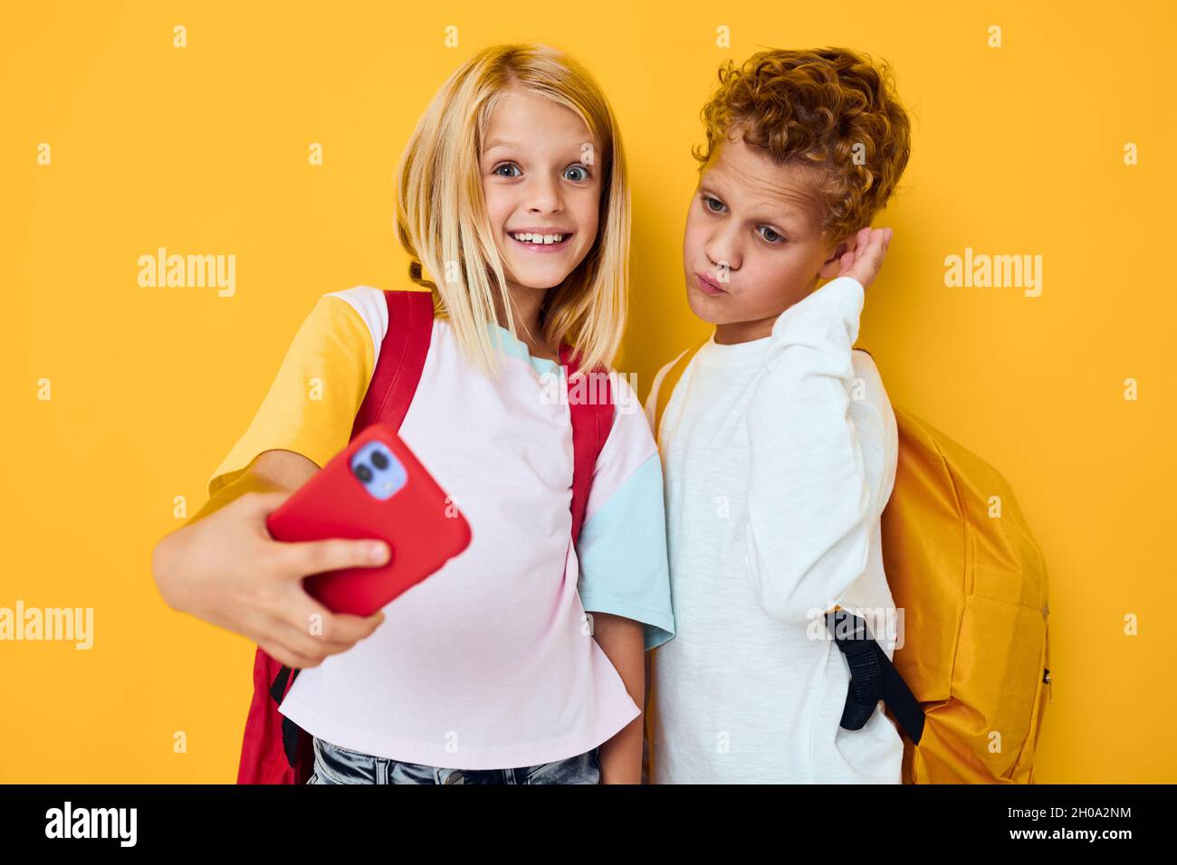 school children looking at the phone entertainment communication ...
