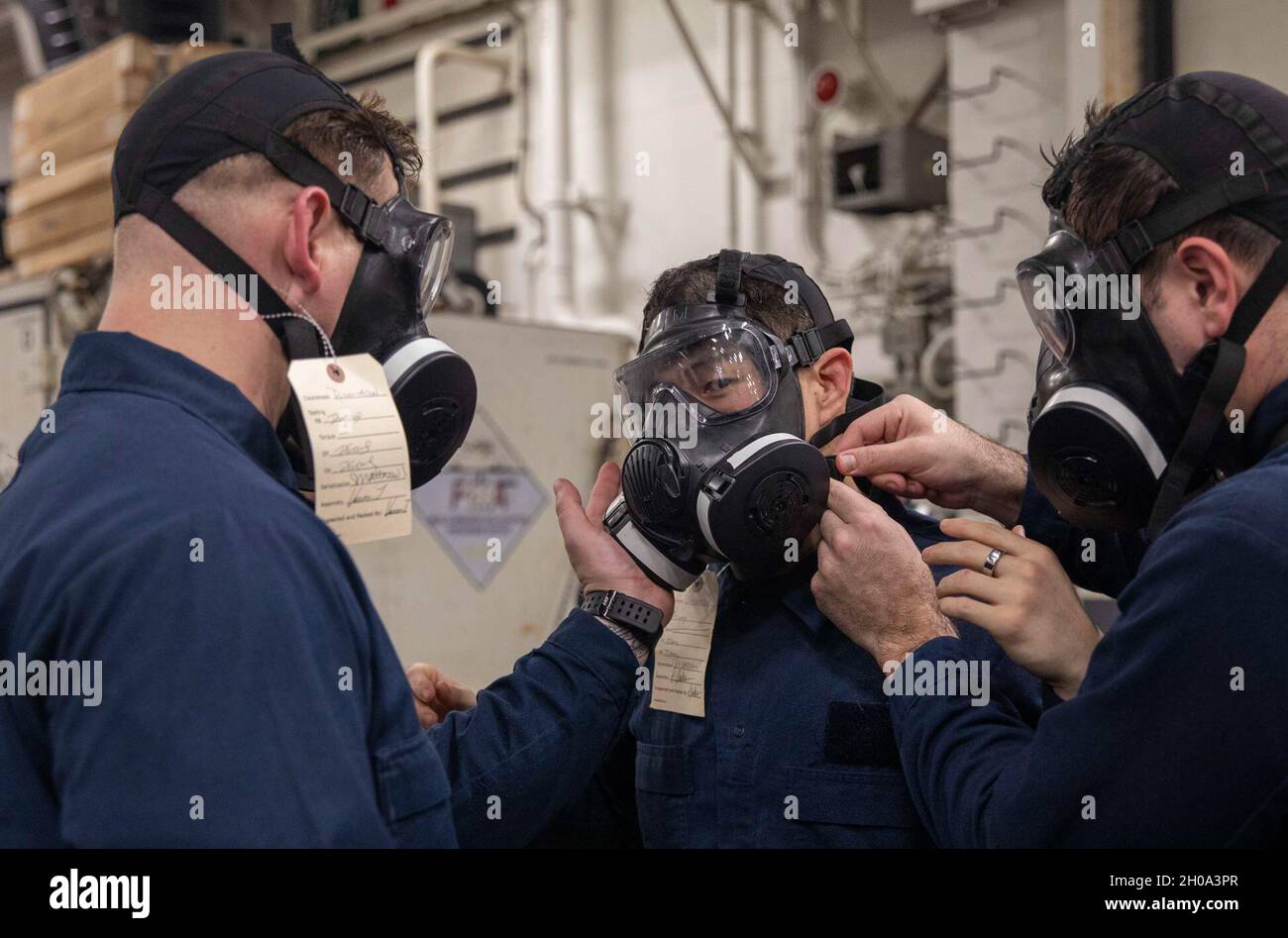 INDIAN OCEAN (Jan. 2, 2021) – U.S. Sailors help each other don gas ...