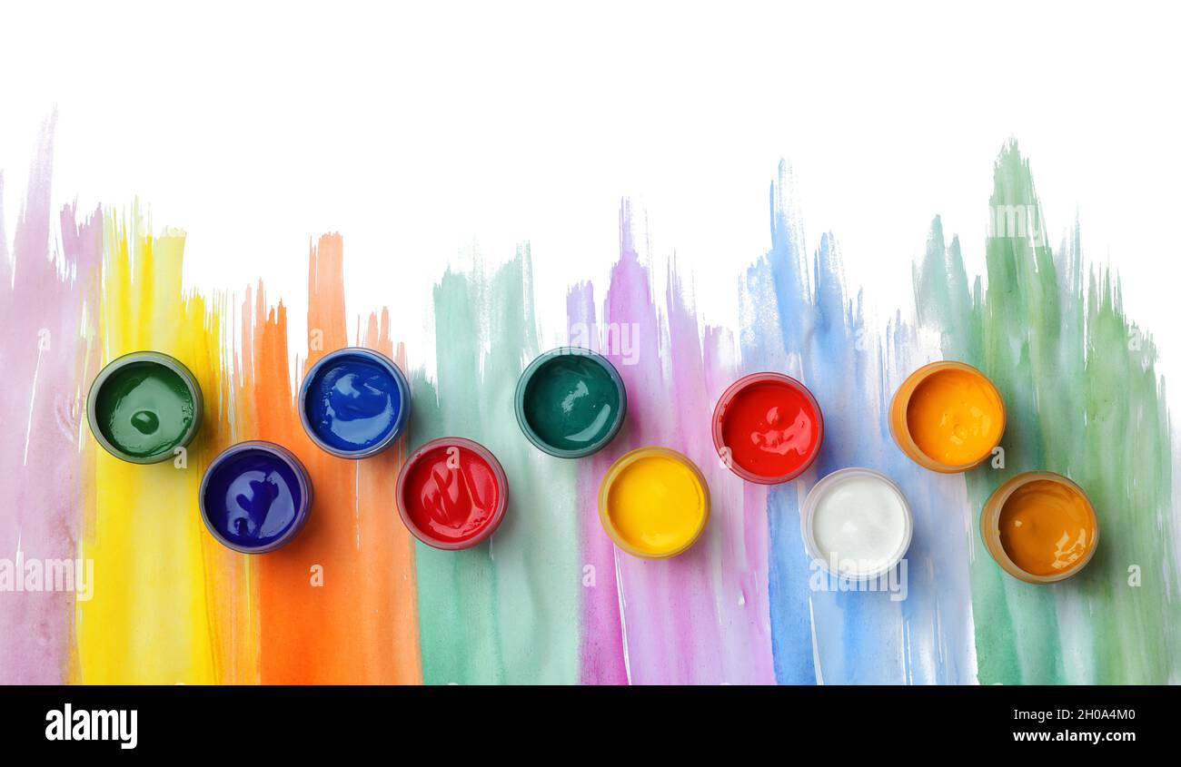 Composition with different paints in jars on light background, top view ...