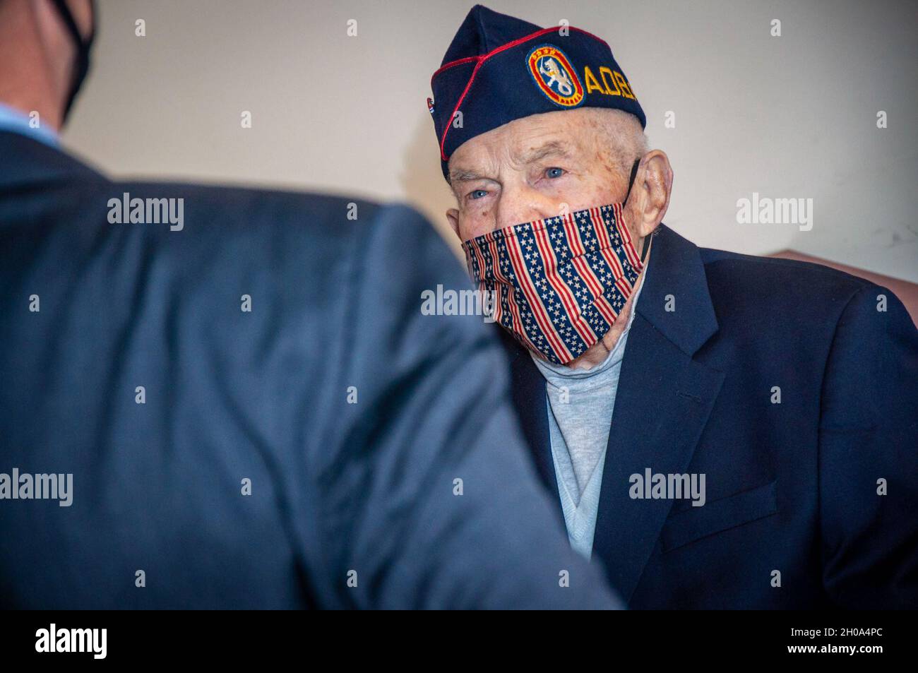U.S. Army Sgt. Dan Crowley (ret.) talks with the Honorable Gregory J ...