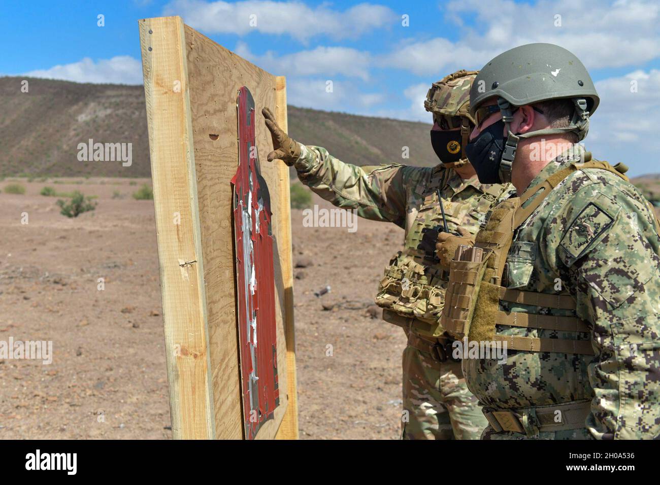 U.S. Navy Command Master Chief Petty Officer Alex Hebert (right ...