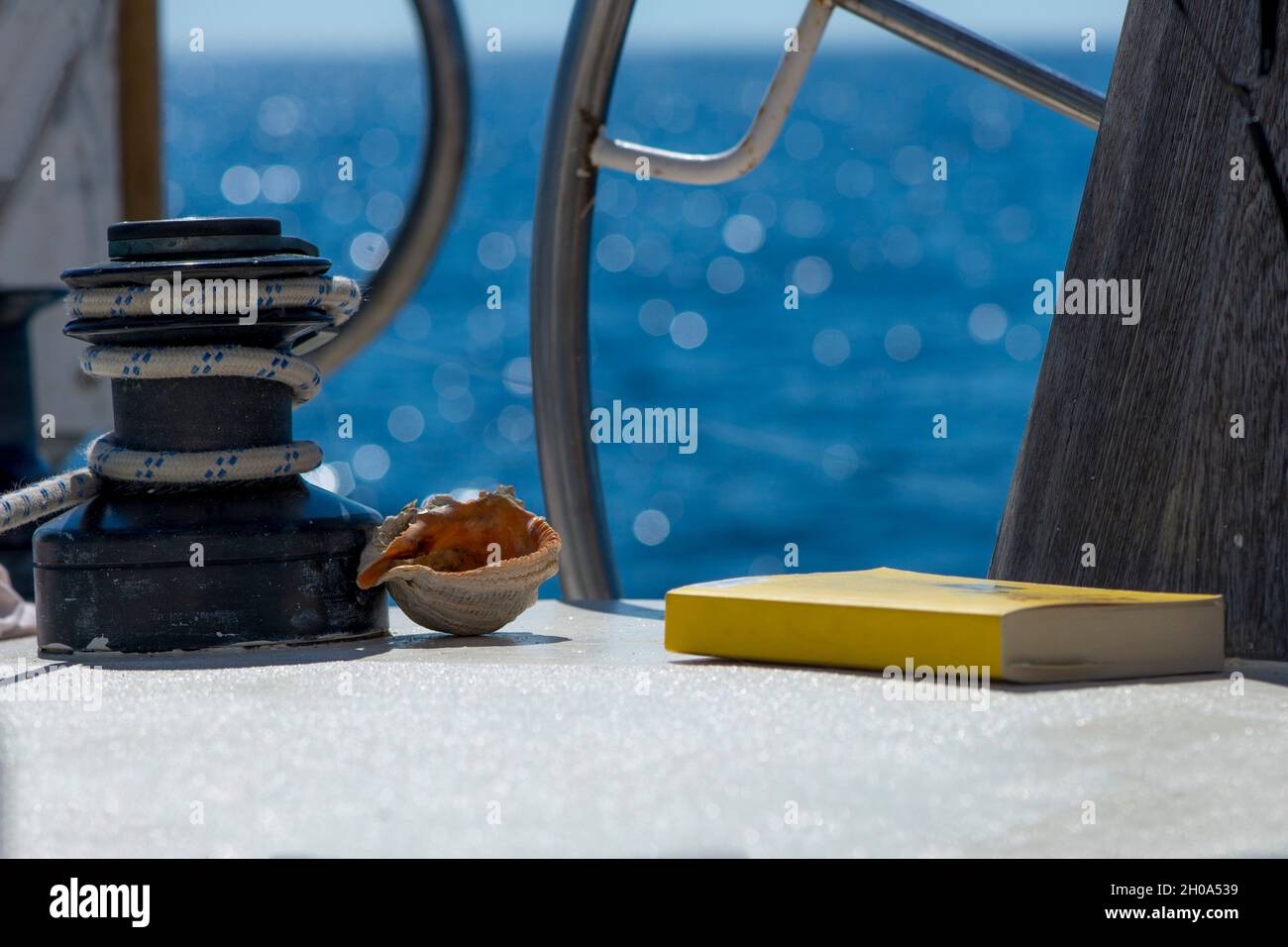 Yacht rest yellow book rope blue see Stock Photo - Alamy