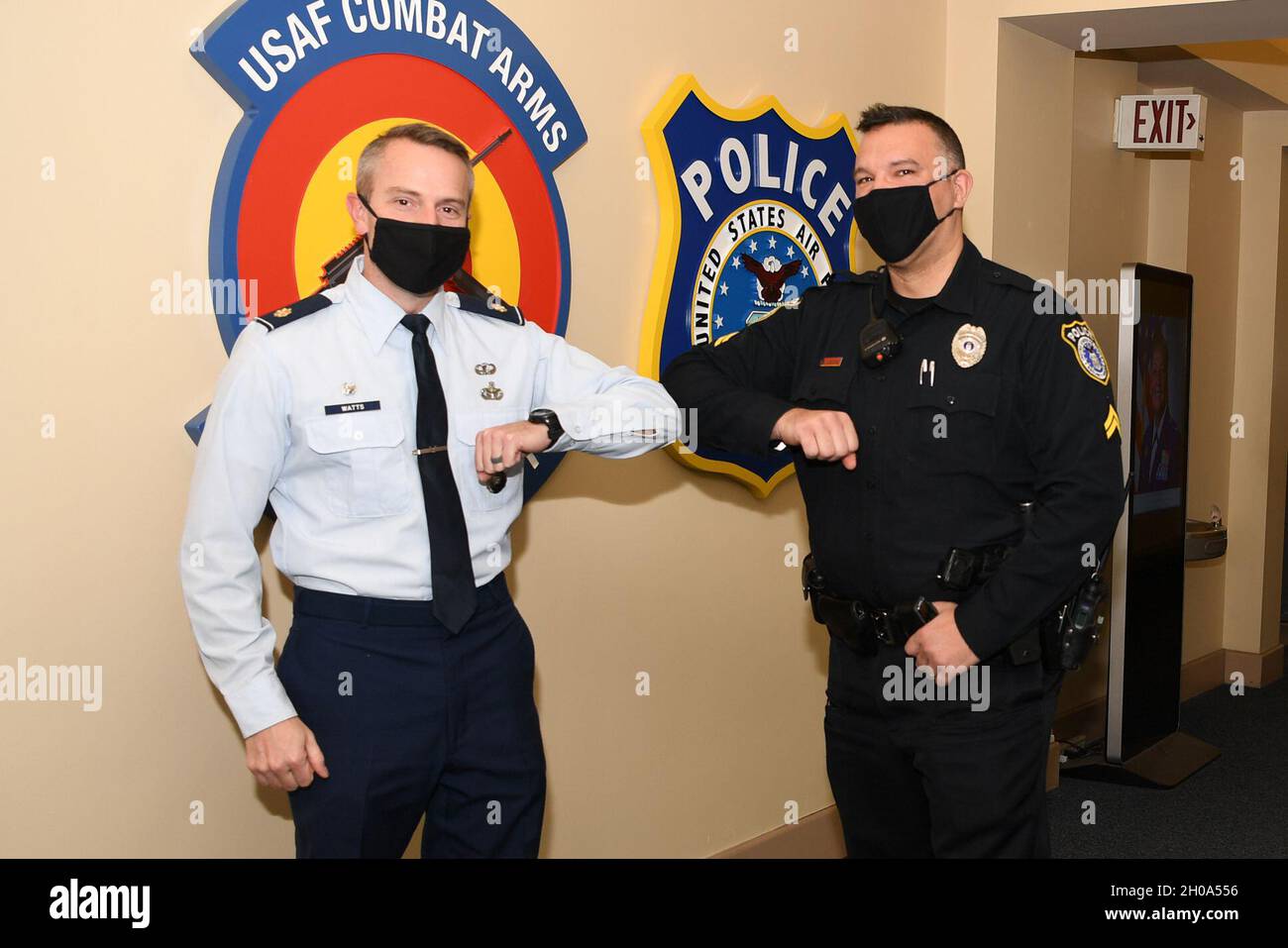 Maj. Shane Watts, 66th Security Forces Squadron commander, bumps elbows ...