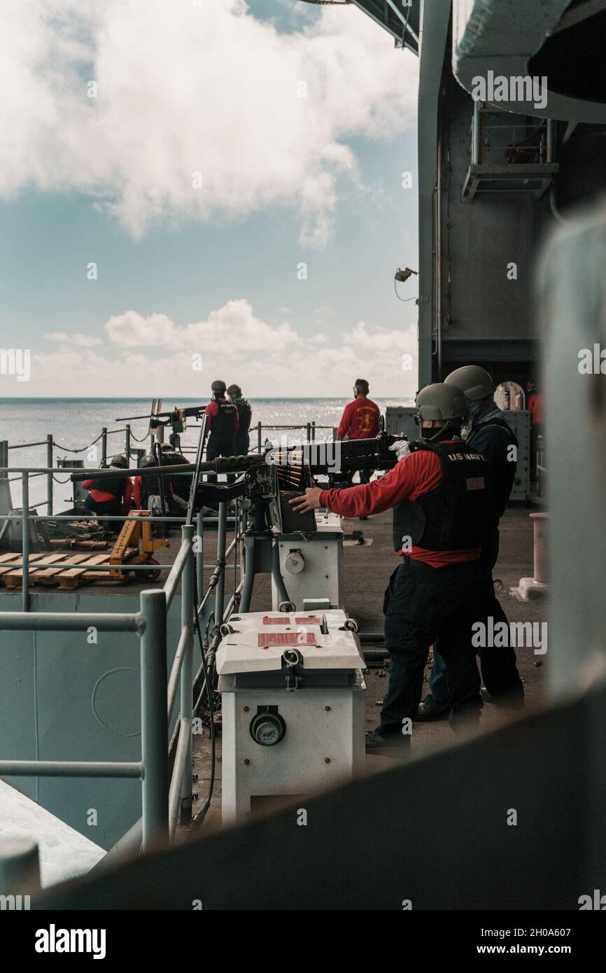 PACIFIC OCEAN (Jan. 5, 2012) U.S. Sailors shoot M2HB machine gun during ...