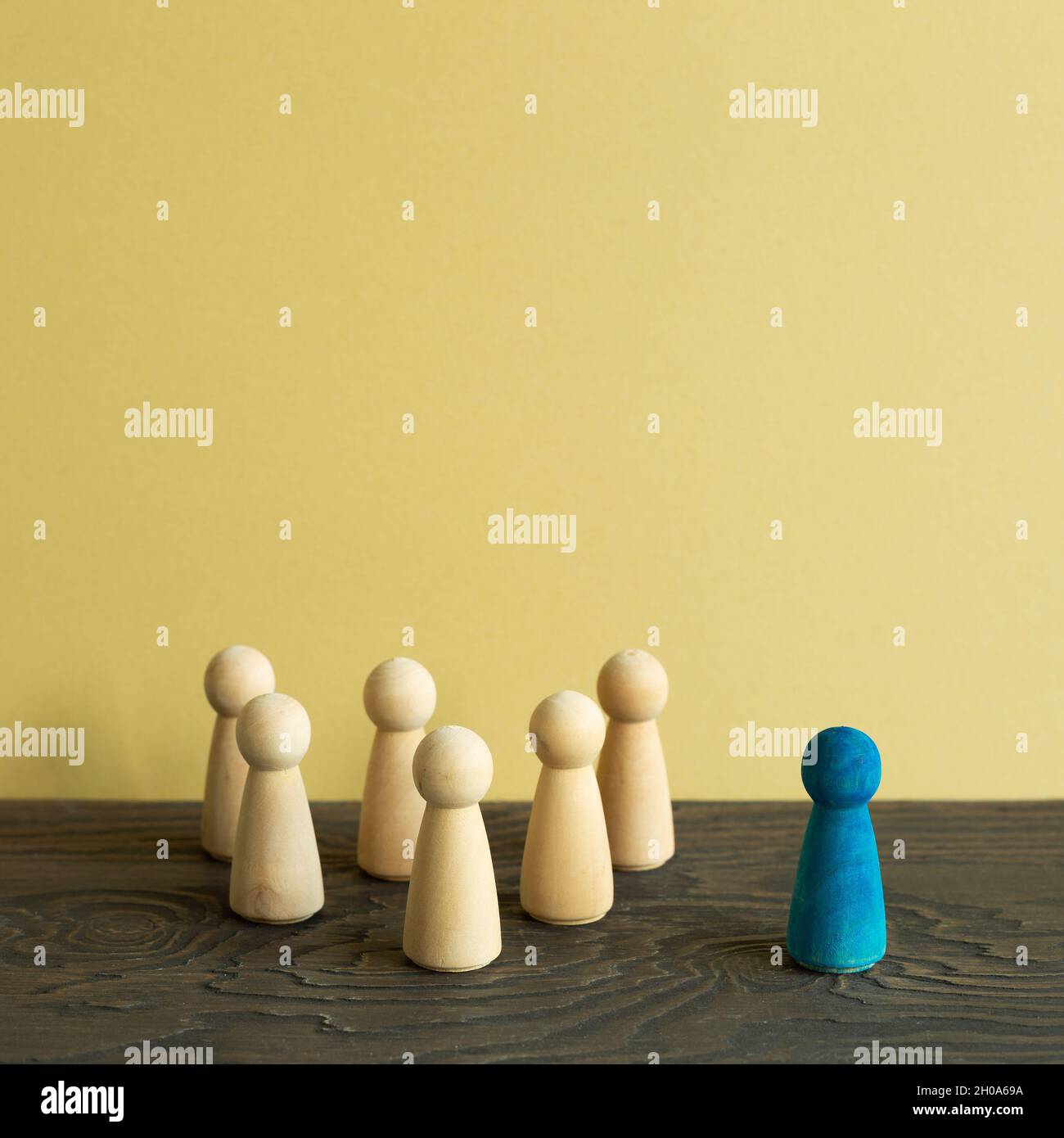 Majority vs minority concept. Wooden human figure on desk. brown ...