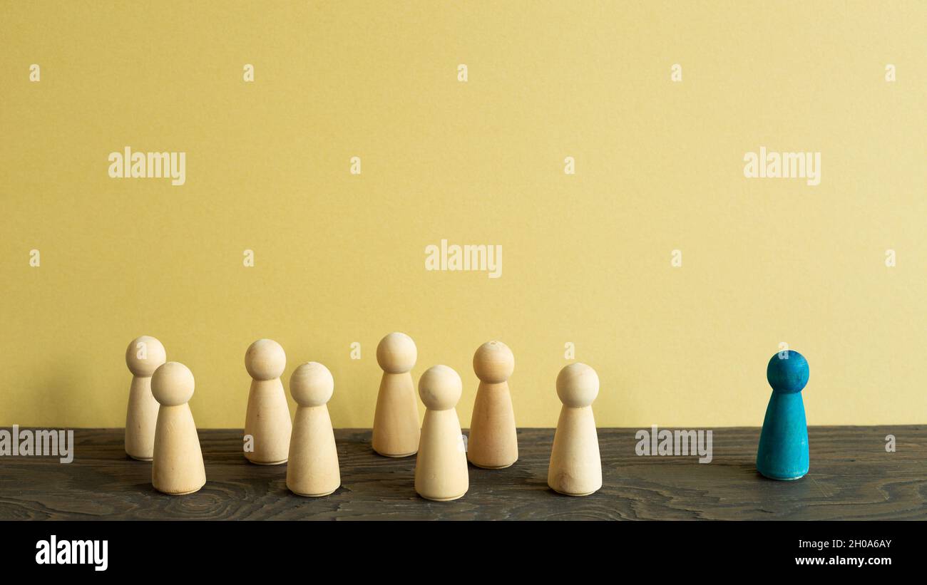 Majority vs minority concept. Wooden human figure on desk. brown ...