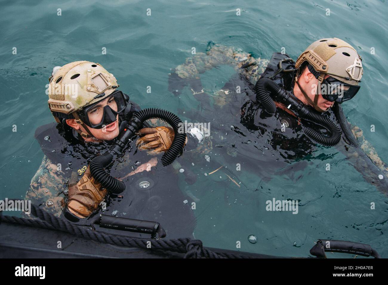 U.S. Marine Corps Cpl. Andre Gordon, left, a radio telephone operator ...