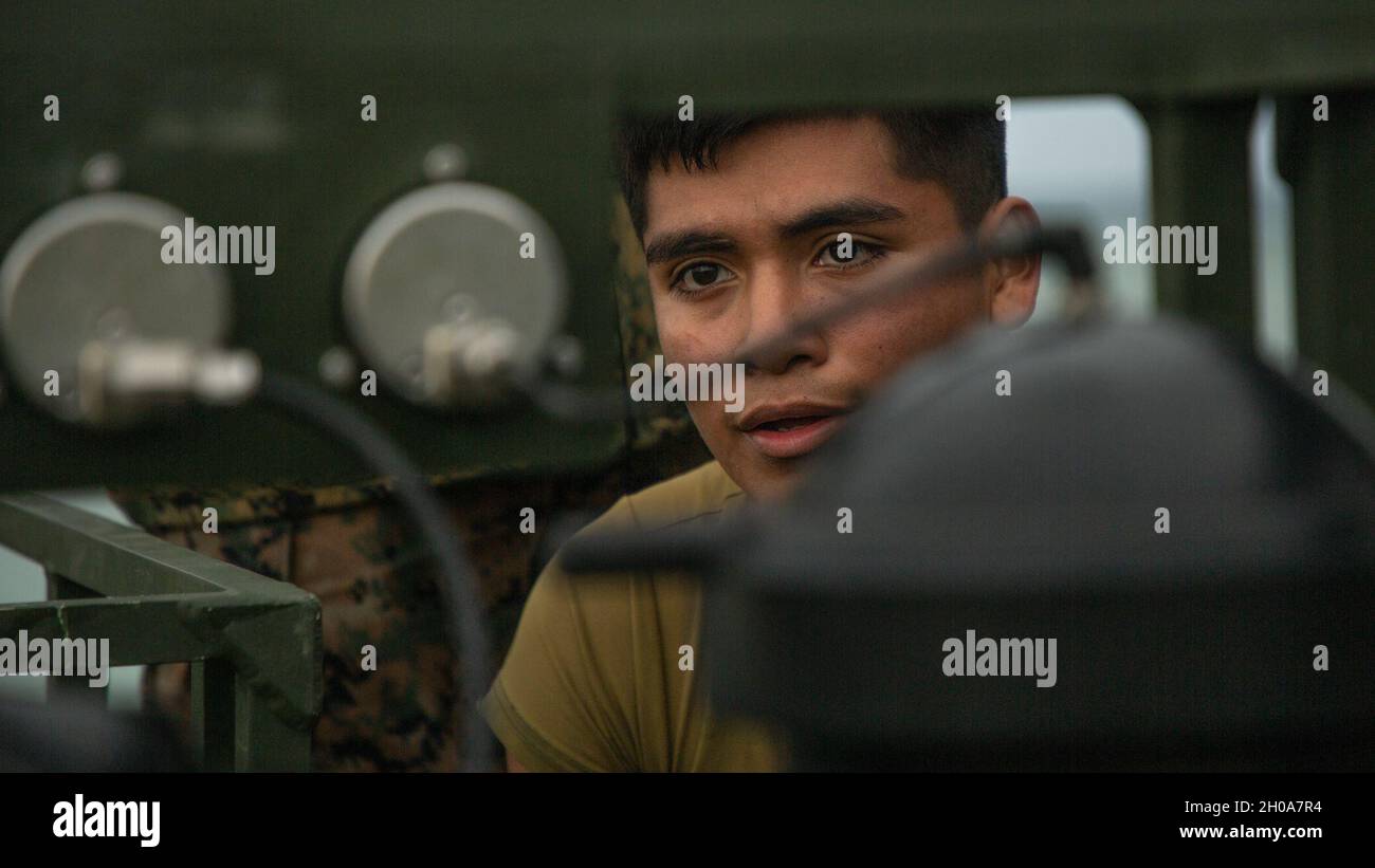 U.S. Marine Corps Lance Cpl. Samuel Velasco, a water purification ...