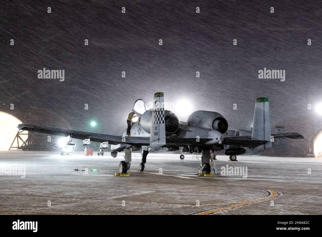 A 25th Aircraft Maintenance Unit Airman performs maintenance on an A-10 ...