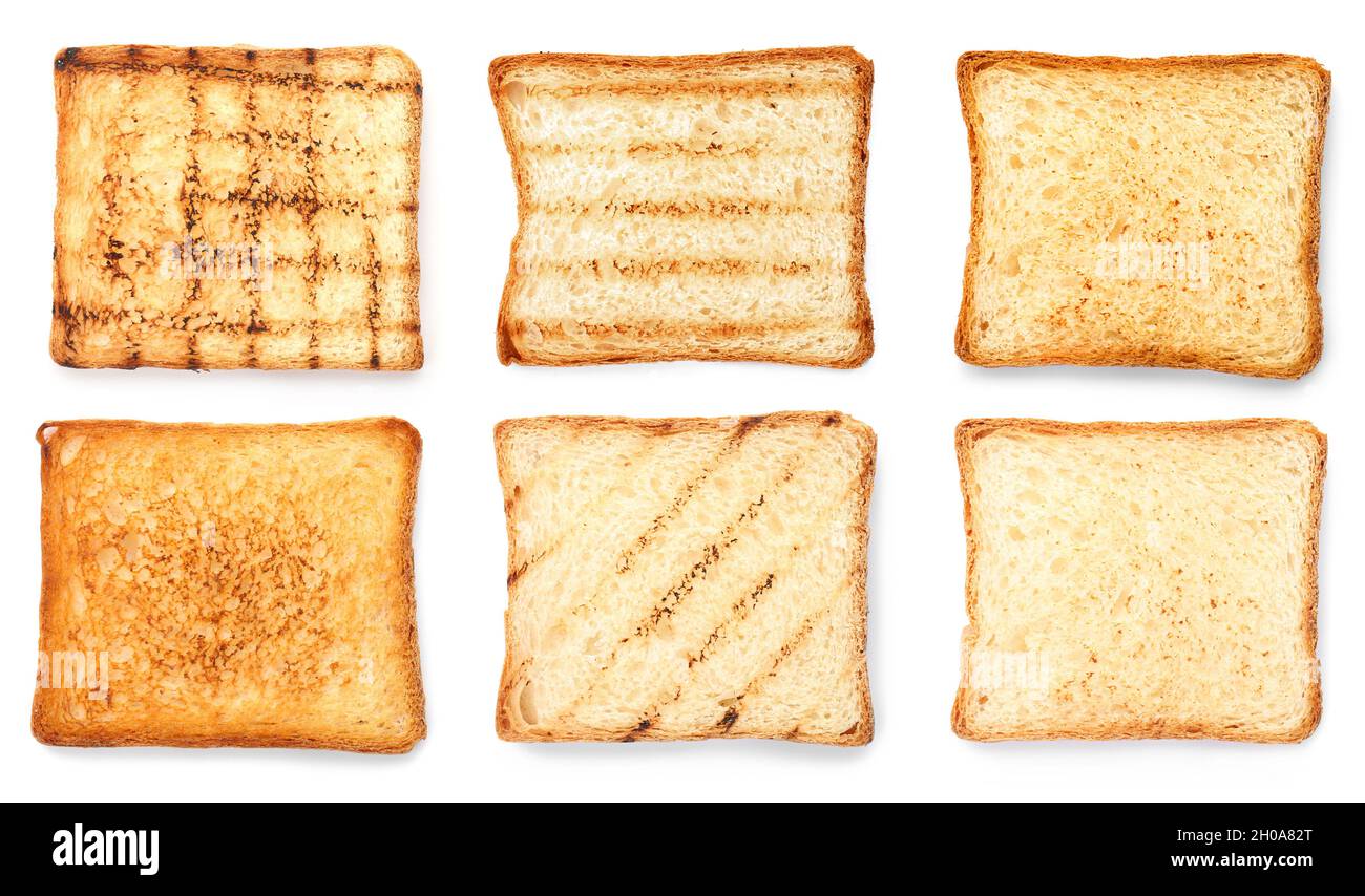 Set with crispy toast bread slices on white background Stock Photo - Alamy