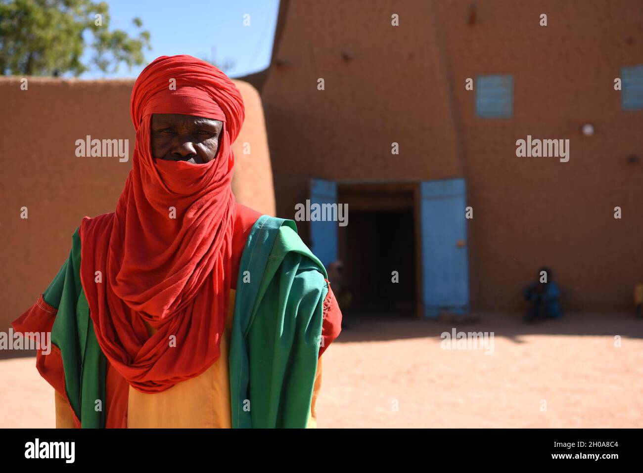 A guard of the Sultan of Agadez poses for a picture outside the mosque ...