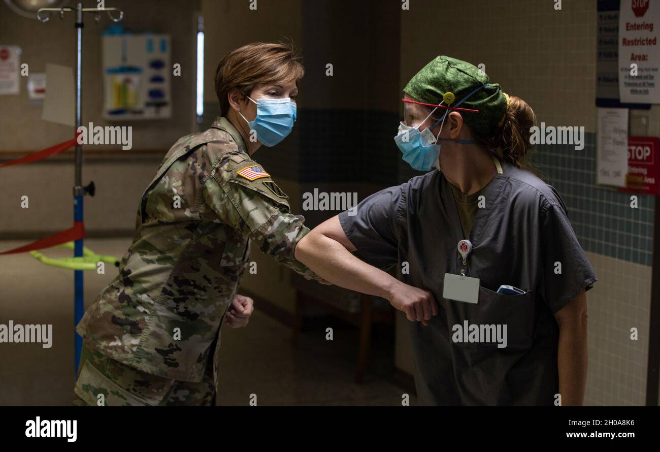 U.S. Army Brig. Gen. Paula Lodi, left, the commander of Regional Health ...