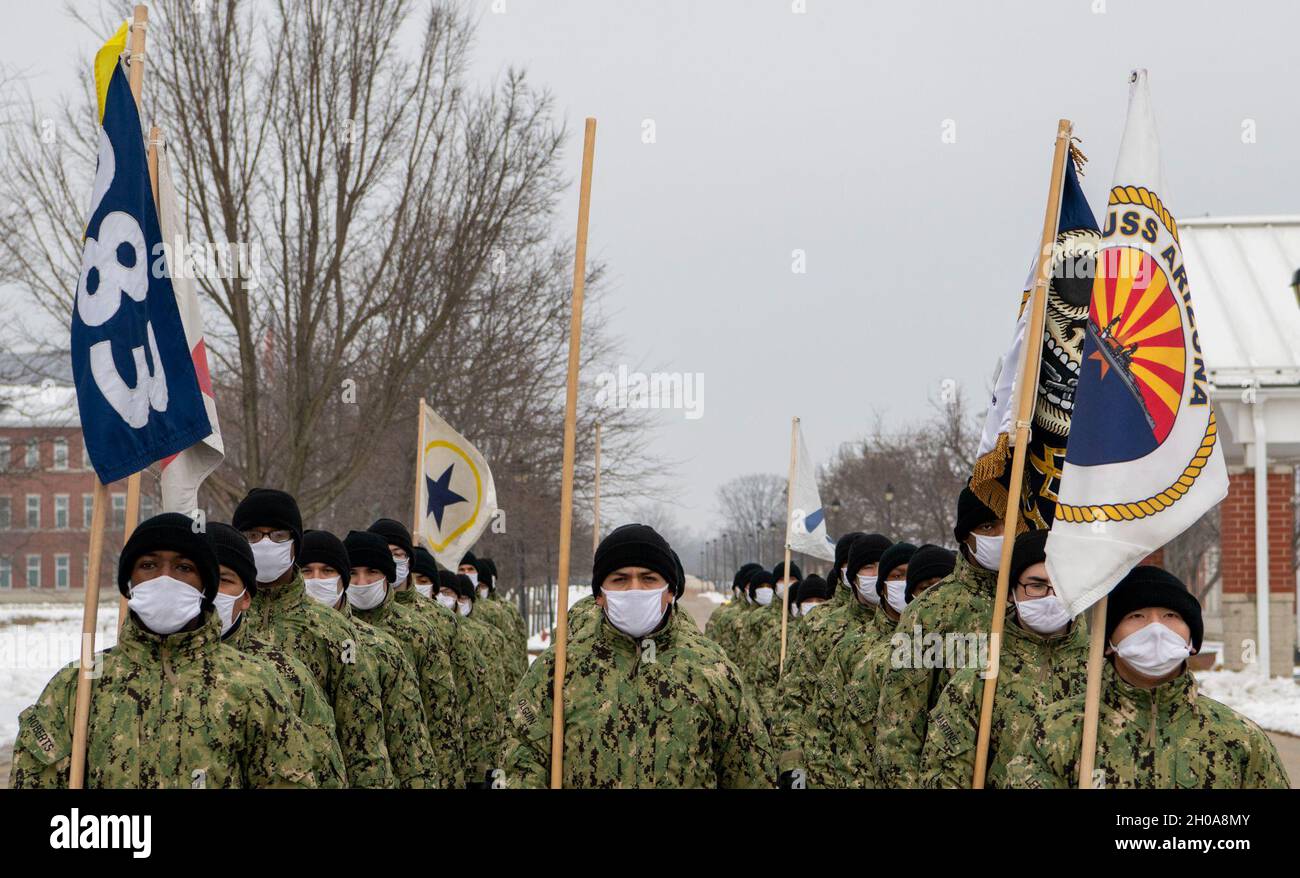 Recruits practice for a drill inspection while marching in formation at ...