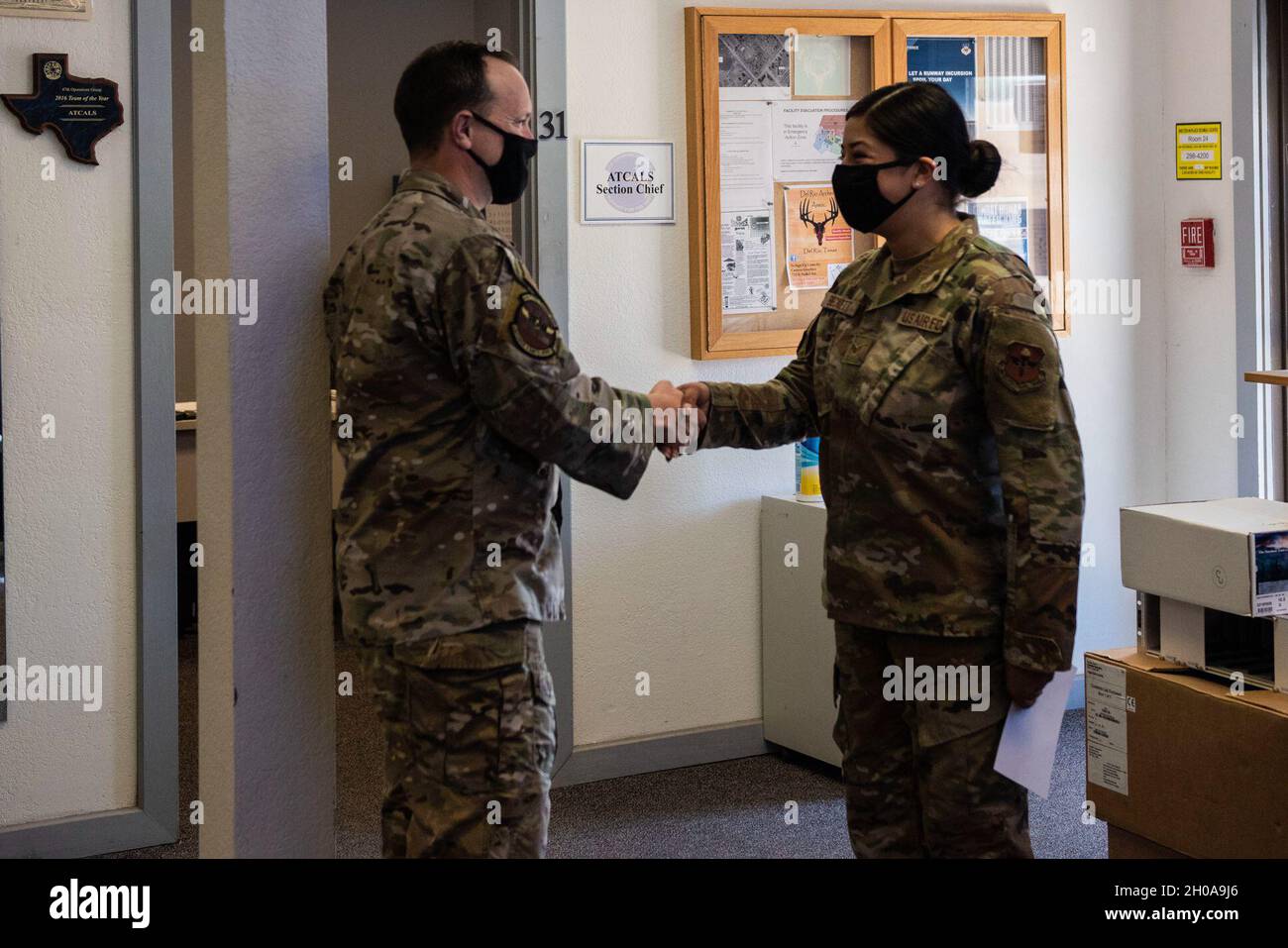Col. Craig Prather, 47th Flying Training Wing commander, congratulates ...