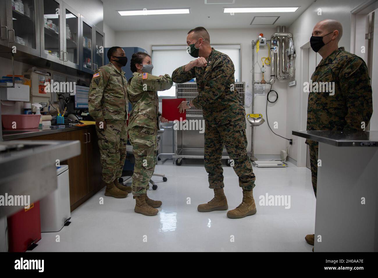 U.S. Marine Corps Col. Lance Lewis, center right, commanding officer of ...