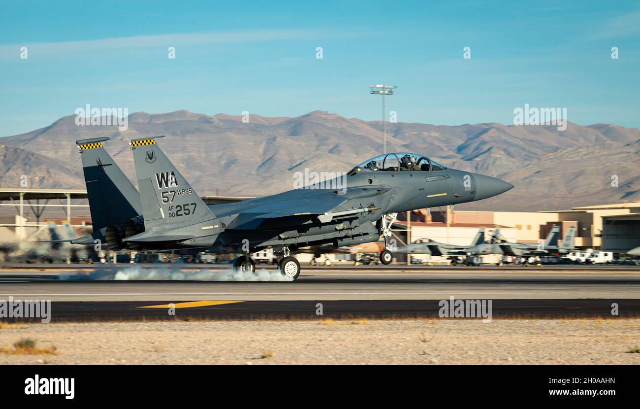An F-15E Strike Eagle fighter jet assigned to the 57th Wing, lands ...