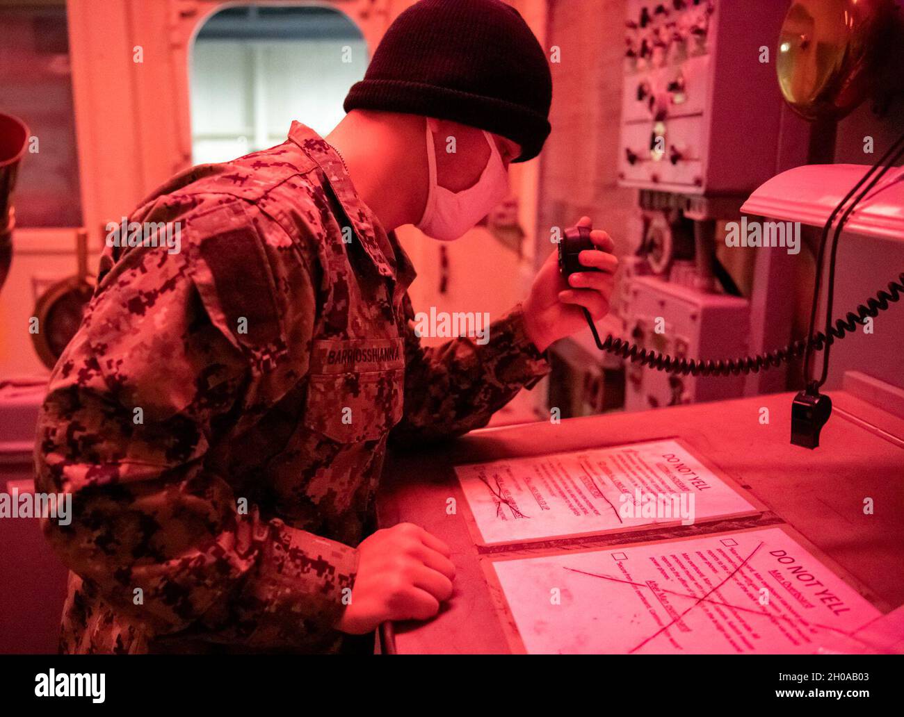 A recruit designated as 'Boats' delivers a message over the 1MC during ...
