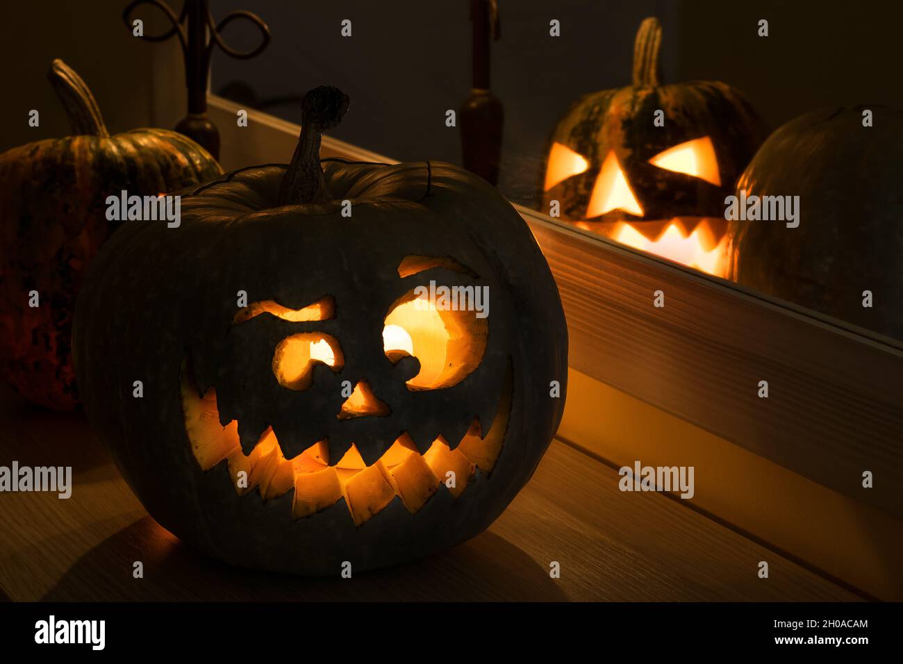 Halloween pumpkin smile and scary eyes for party night with reflection ...
