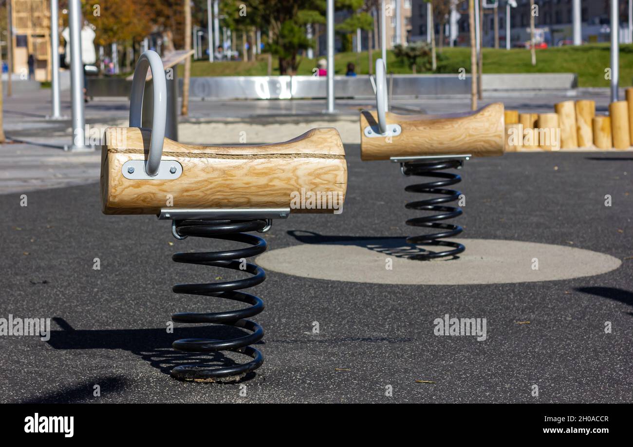 Playground at the elementary school. Spring loaded rocker. Children ...