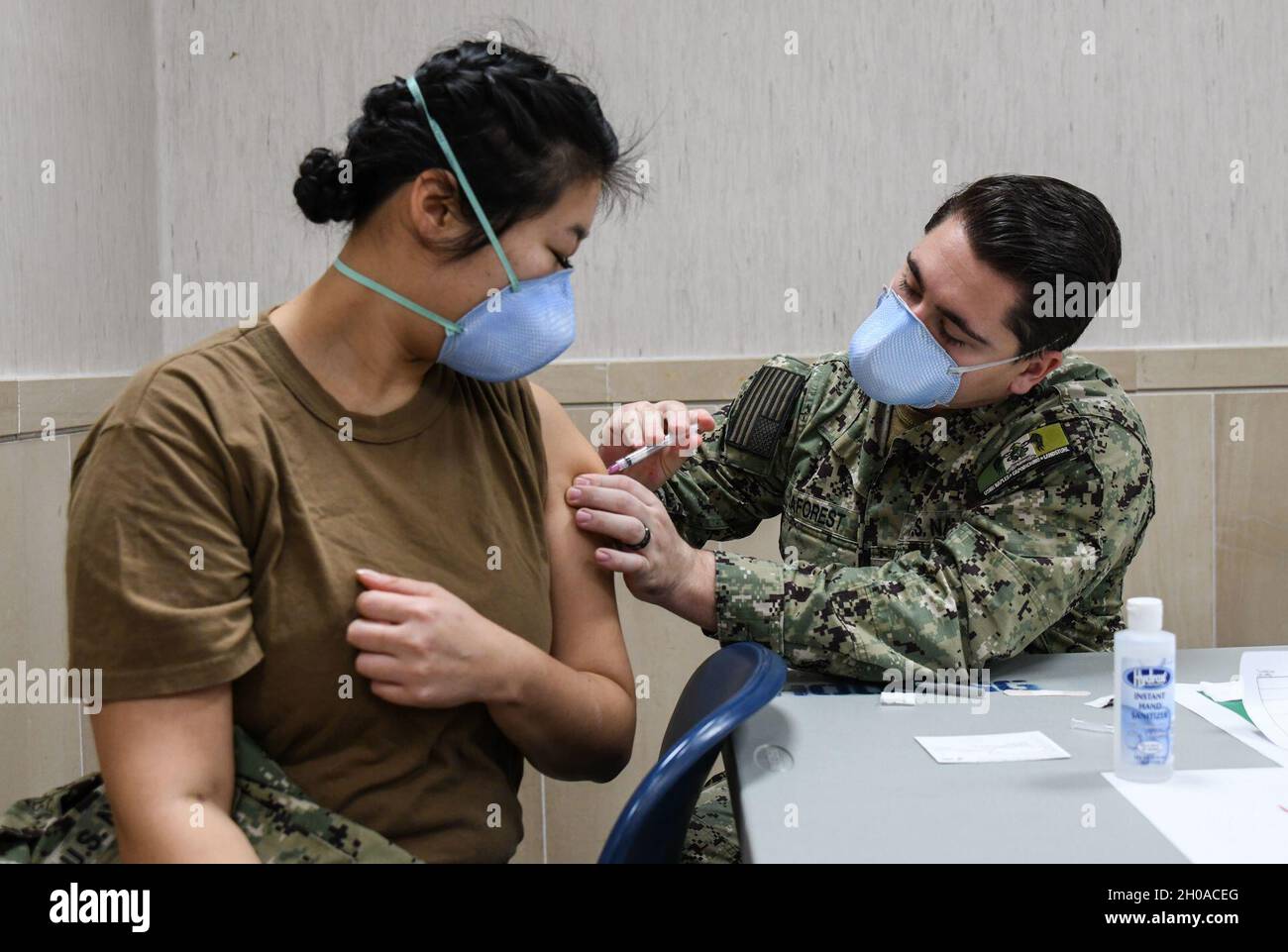 Lt. Cmdr. Kelly Peng, an emergency medicine physician assigned to U.S ...