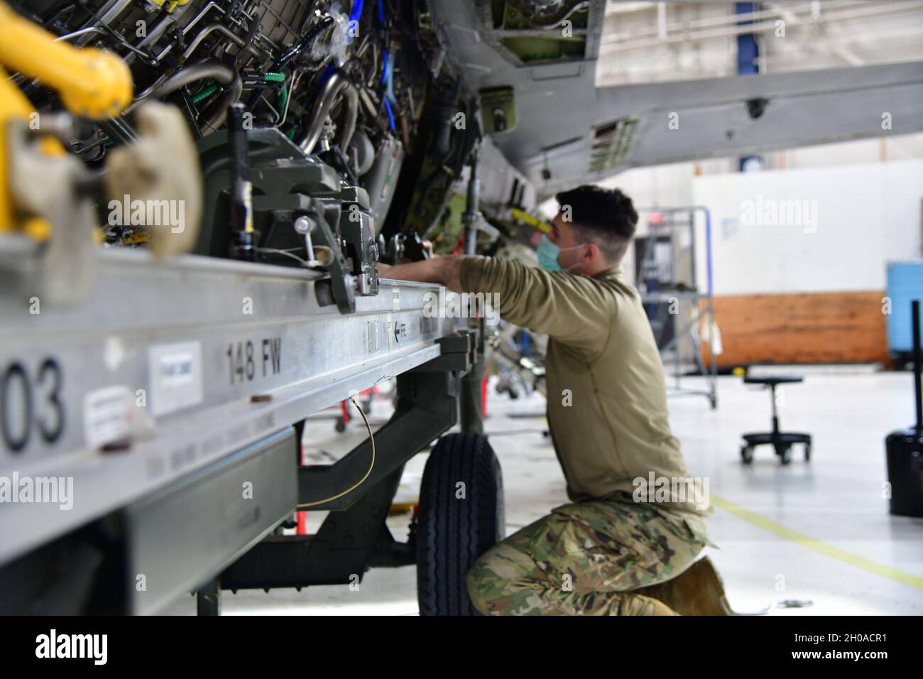 A propulsion specialist, also known as a jet engine mechanic, removes ...